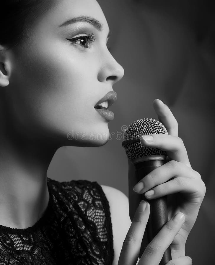 Woman Singer with Microphone Stock Photo - Image of elegant, holding ...