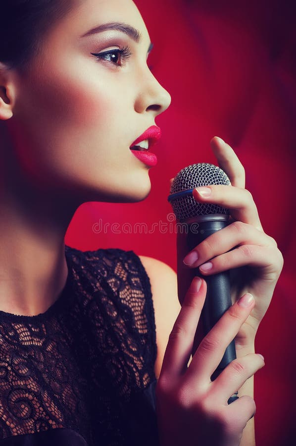 Headshot of Female Singer Keeping Microphone Stock Photo - Image of ...