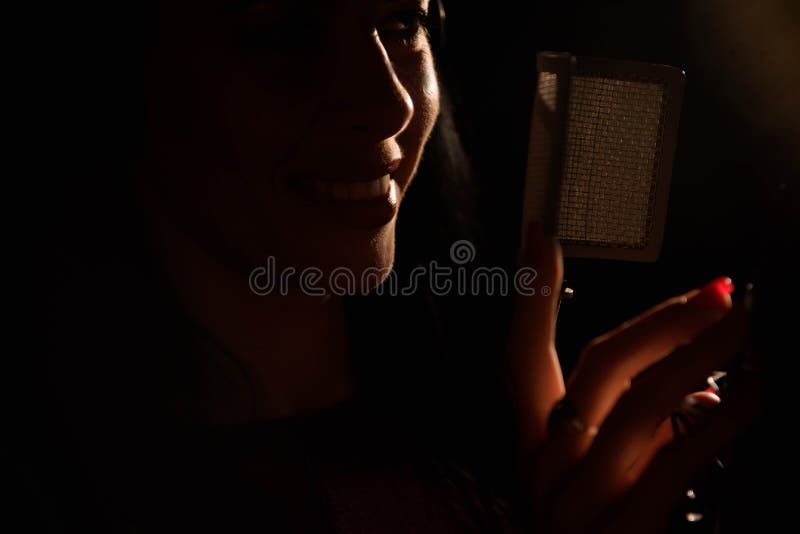 Woman Singer Singing a Song in the Recording Studio. Stock Image ...