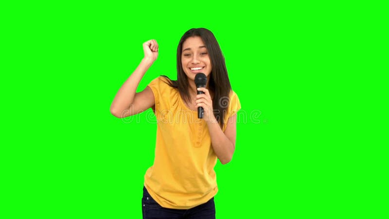 Woman Singing and Dancing on Green Screen Stock Video - Video of ultra ...