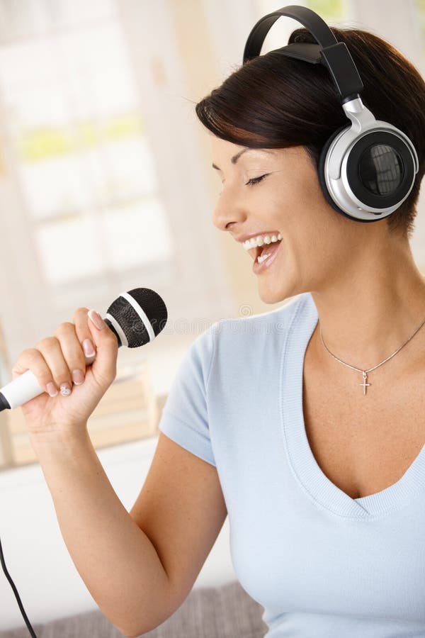 Woman Singing With Microphone Stock Photo - Image of headphone ...