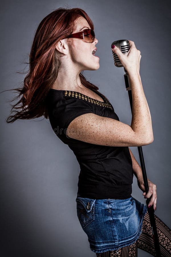 Woman Singing with Microphone Stock Image - Image of singer, portrait ...