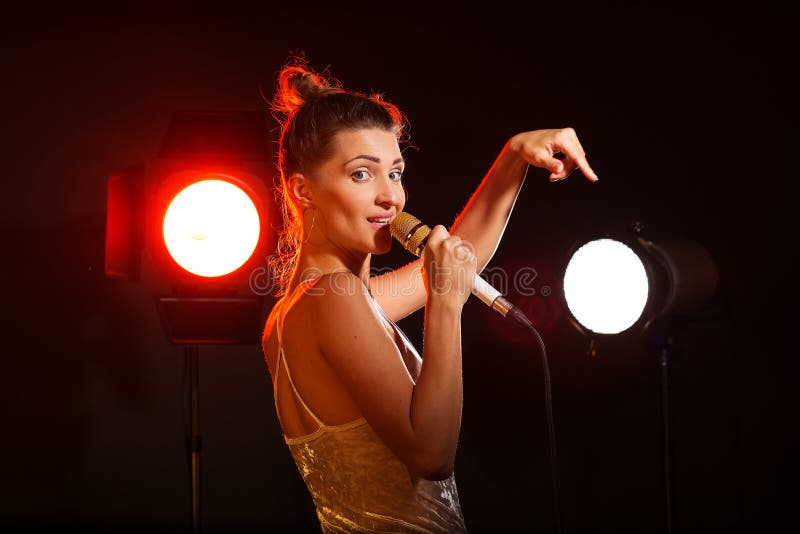 A Woman Sings a Song in the Studio Stock Photo - Image of glamour ...