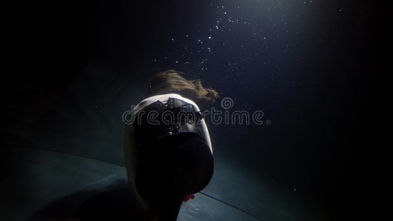 Woman is Sinking in Dark Pool, Underwater Shot, Slow Motion, Dramatic ...