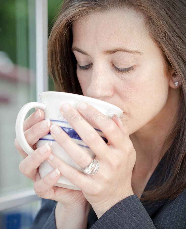 Woman sipping coffee stock photo. Image of businessperson - 22086124