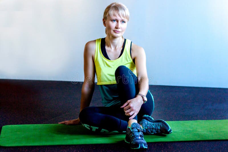 Woman Sit on the Mat in the Gym Stock Image - Image of training ...