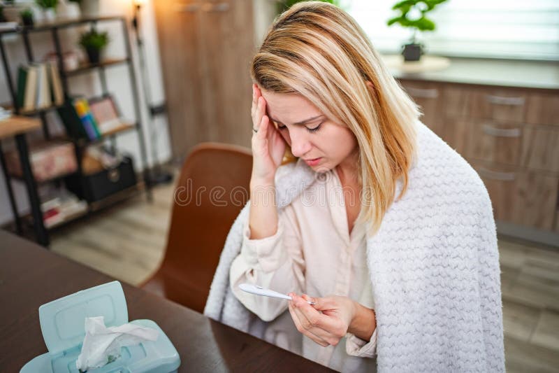Feeling Unwell at Home while Checking Temperature with Worry Stock ...