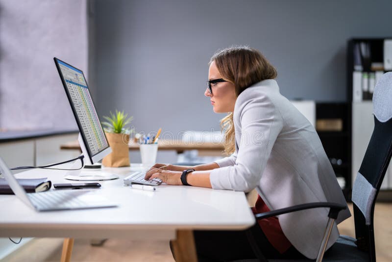 Woman Sitting in Bad Posture Working on Computer Stock Photo - Image of ...