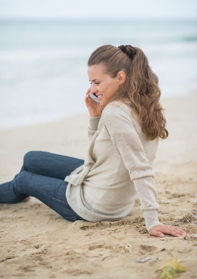 Woman Sitting on Beach and Talking Mobile Phone Stock Image - Image of ...