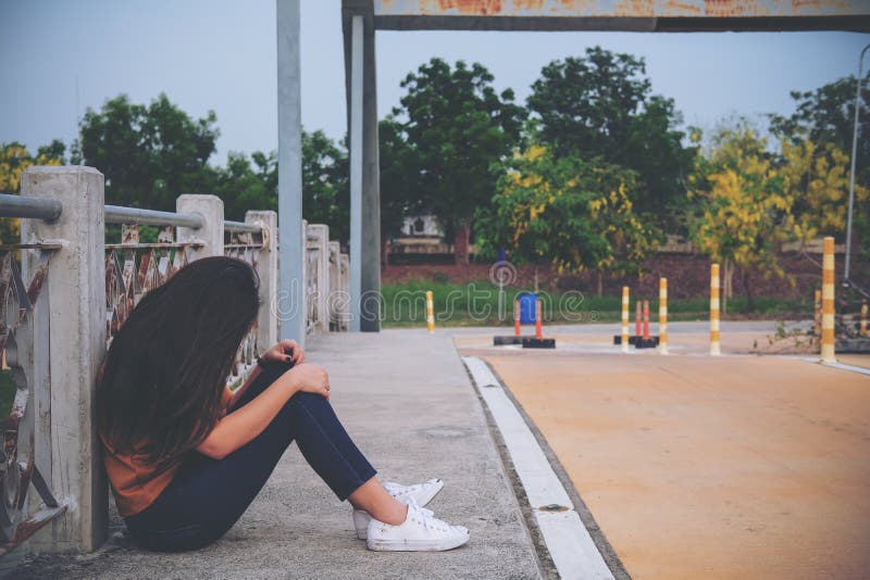 A Woman Sitting on the Bridge with Feeling Sad Stock Image - Image of ...