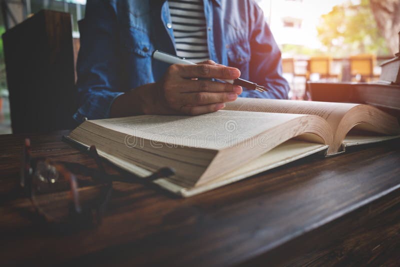 Woman Sitting in a Cafe, Reading Book Stock Image - Image of hand ...