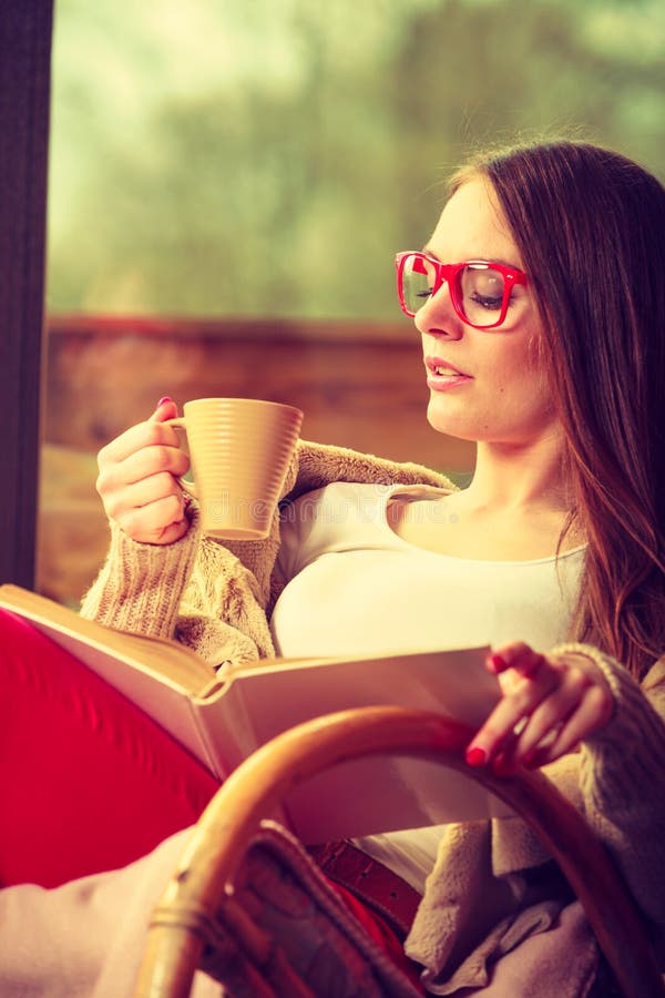 Woman Sitting On Chair Reading Book At Home Stock Image Image Of