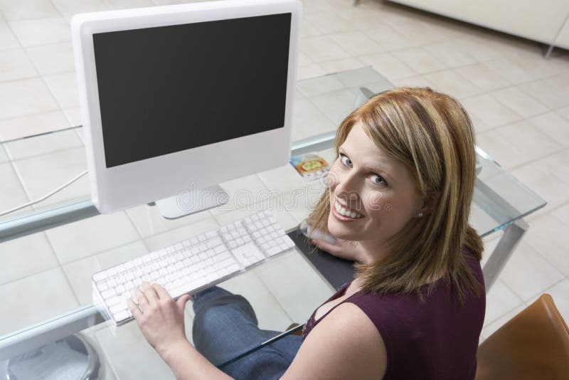 Woman Sitting at Computer stock image. Image of mouse - 30842773
