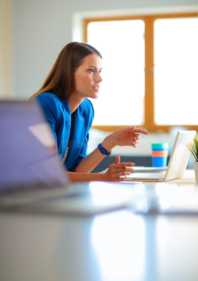 Woman Sitting on the Desk with Laptop Stock Image - Image of desk ...