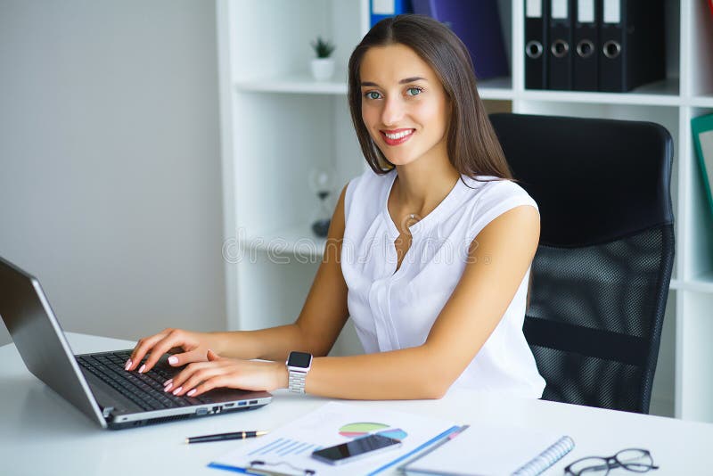 Woman Sitting at Desk, Working on Laptop in Modern Office Stock Photo ... Woman Sitting at Desk, Working on Laptop in Modern Office Stock Photo ...