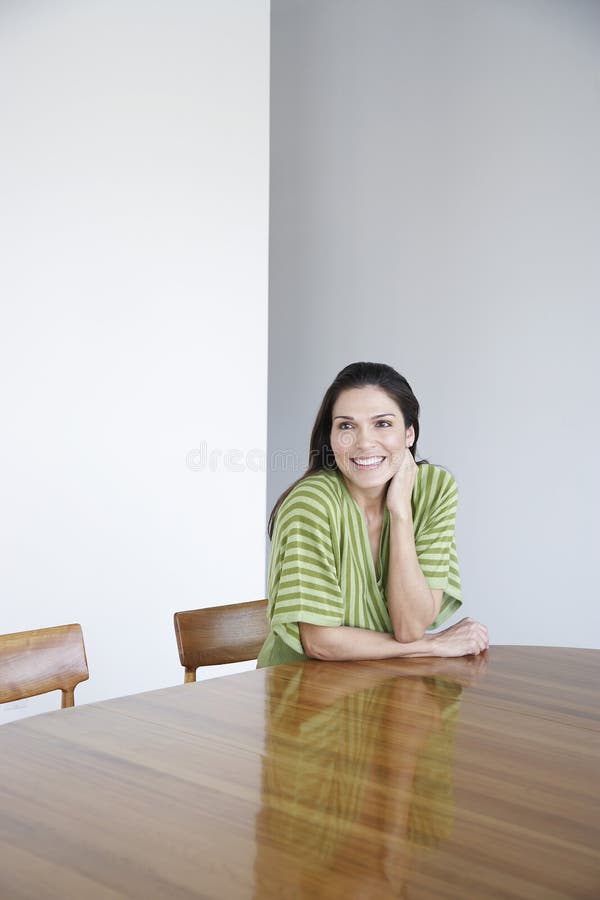 Woman Sitting at Dining Table Stock Photo - Image of simplicity, female ...