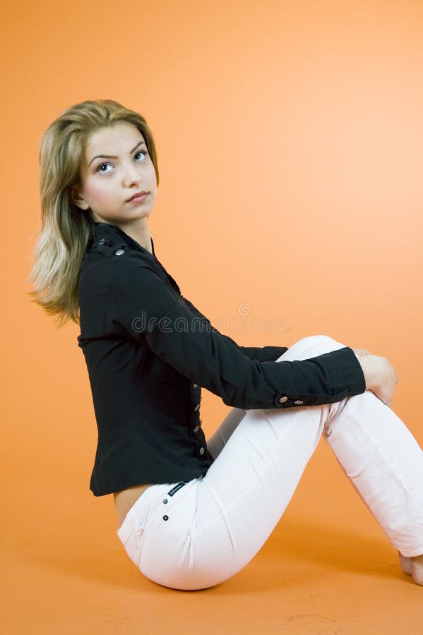 Woman Sitting Down, Glancing Back Stock Image - Image of cute ...