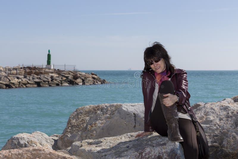 Woman Sitting at the Exit of the Port Stock Photo - Image of autumn ...
