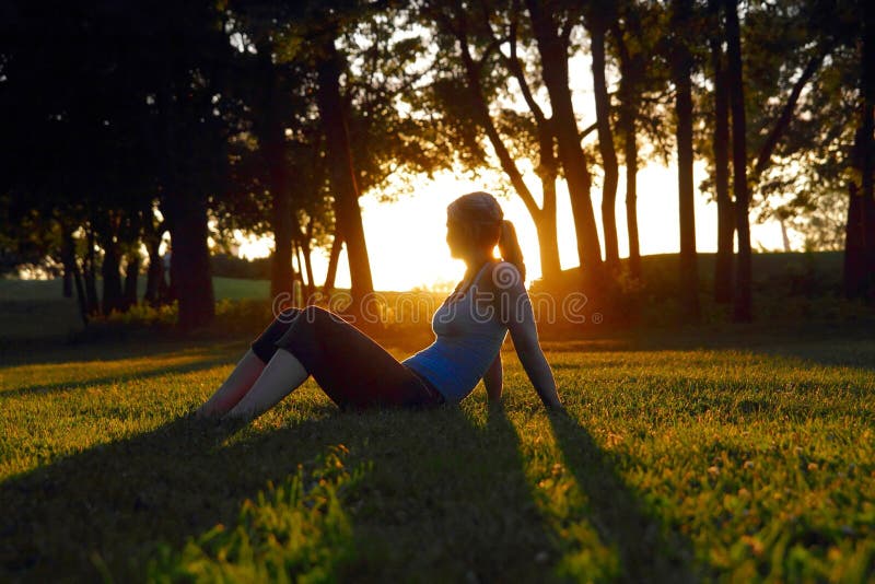 Woman Sitting in the Glow of the Setting Sun Stock Image - Image of ...