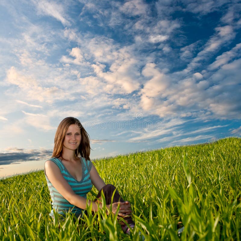Woman sitting on grass stock photo. Image of beauty, leisure - 12038826