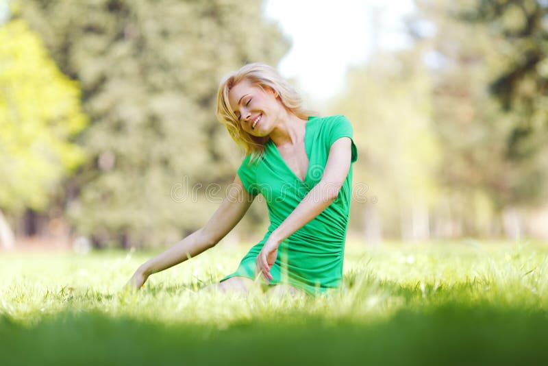 Woman Sitting On Grass Stock Image Image Of Casual Happiness 32436013