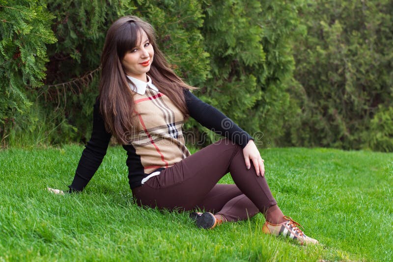 Woman sitting on the grass stock photo. Image of healthy - 70705248