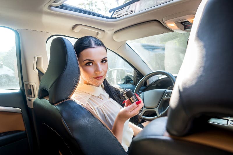 Woman Sitting Inside New Car Offering Key Stock Photo - Image of ...