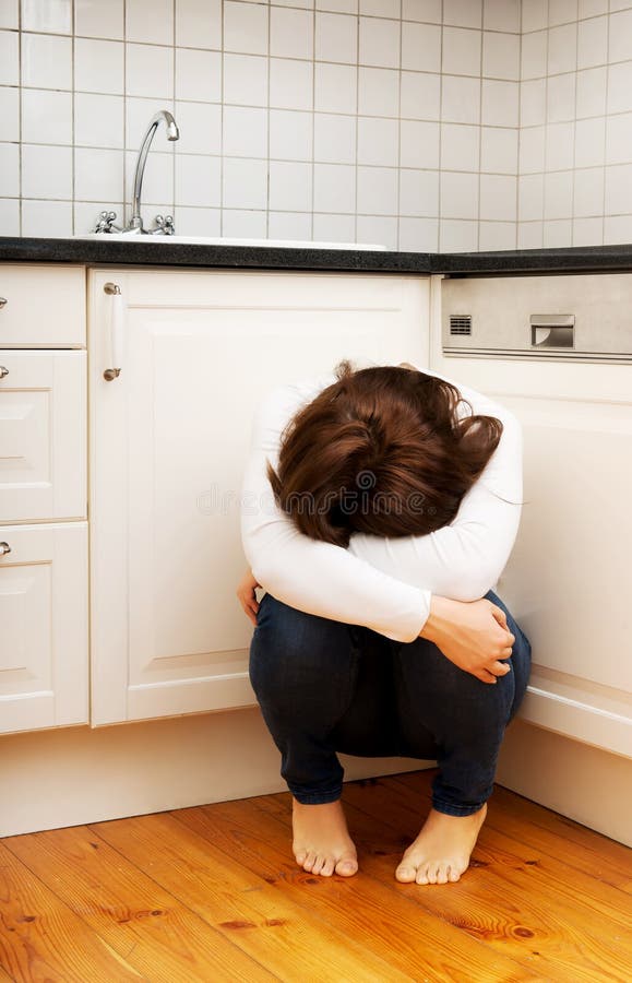 Woman Sitting on Kitchen Floor in Depression. Stock Photo - Image of ...