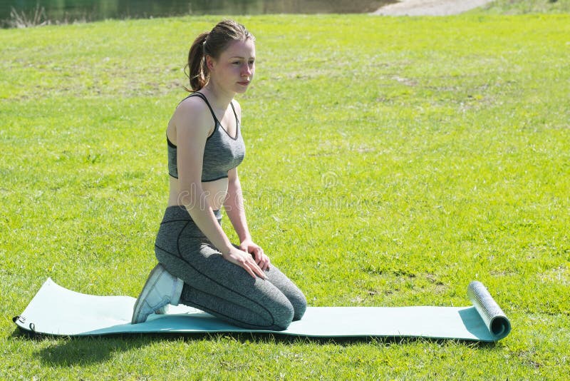Woman sitting on mat stock photo. Image of beautiful - 96151650