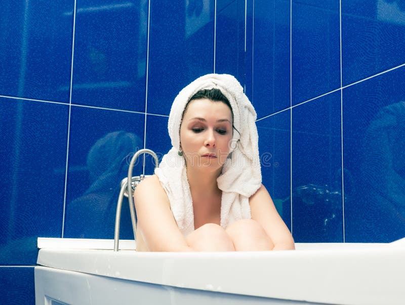 Woman sitting in bath stock photo. Image of lifestyle - 142947736