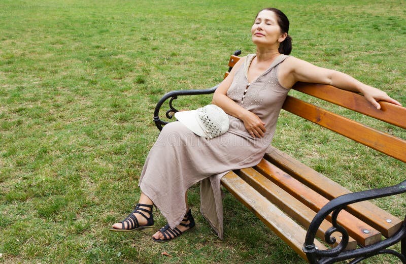Woman Sitting on Park Bench Stock Image - Image of portrait, outdoor ...