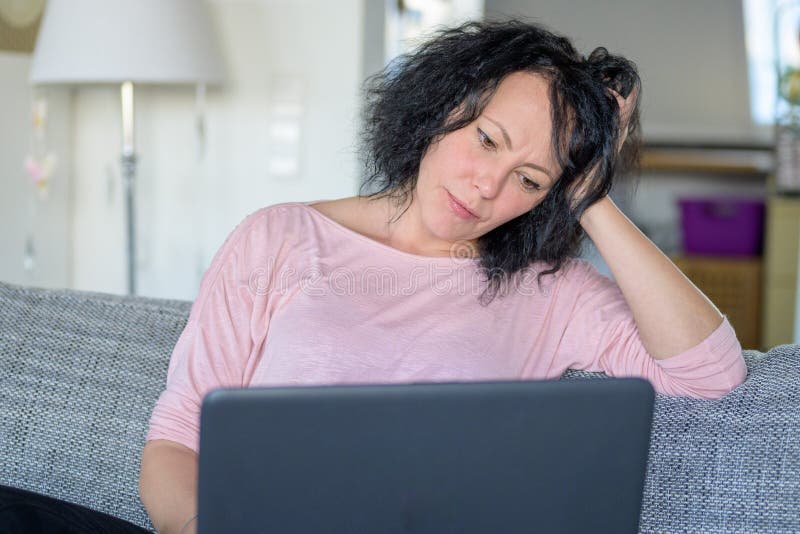 Woman Sitting Pensively at Her Computer Stock Photo - Image of ...