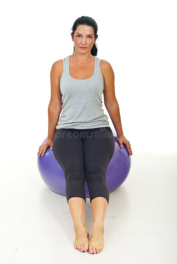 Woman Sitting on Pilates Ball Stock Photo - Image of aerobics, ball ...
