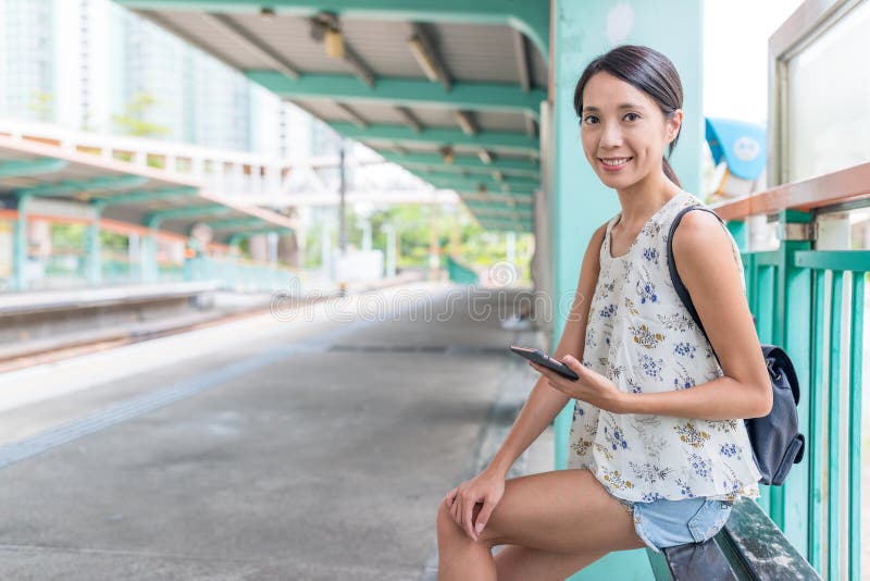 Woman Sitting at Platform and Waiting for Train Stock Photo - Image of ...