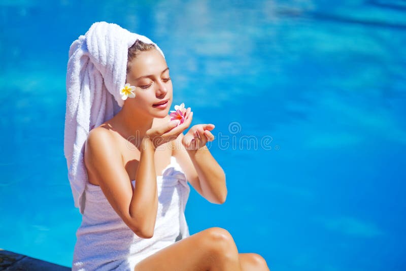 Woman Sitting beside a Pool Stock Photo - Image of hands, harmony: 61743674