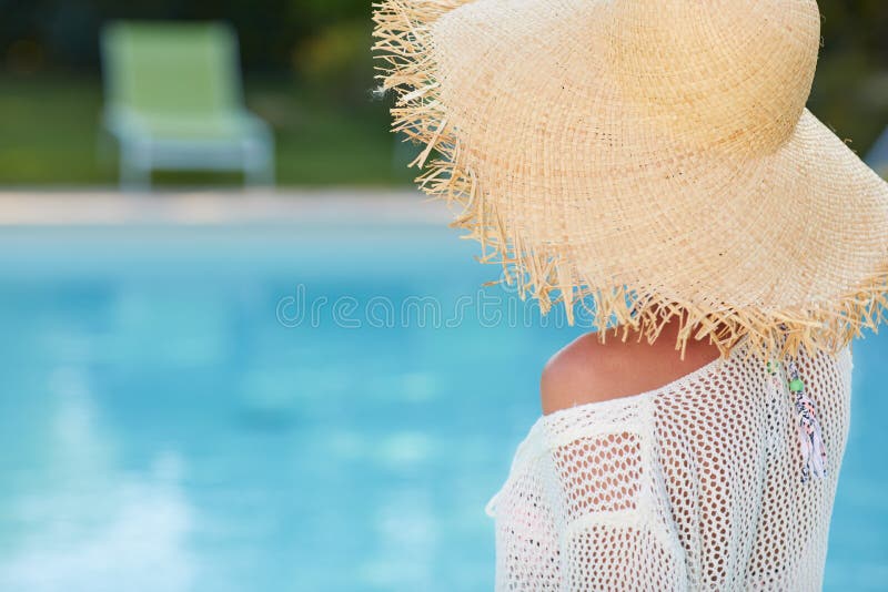 Woman Sitting by the Pool Side and Smiling Over Her S Stock Photo ...