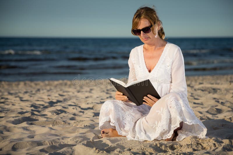 Woman Sitting and Reading Book on Beach Stock Image - Image of people ...