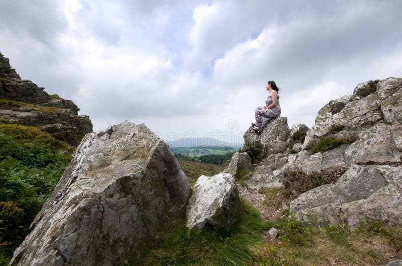 Woman sitting on rock stock image. Image of horizon, hiking - 20557461