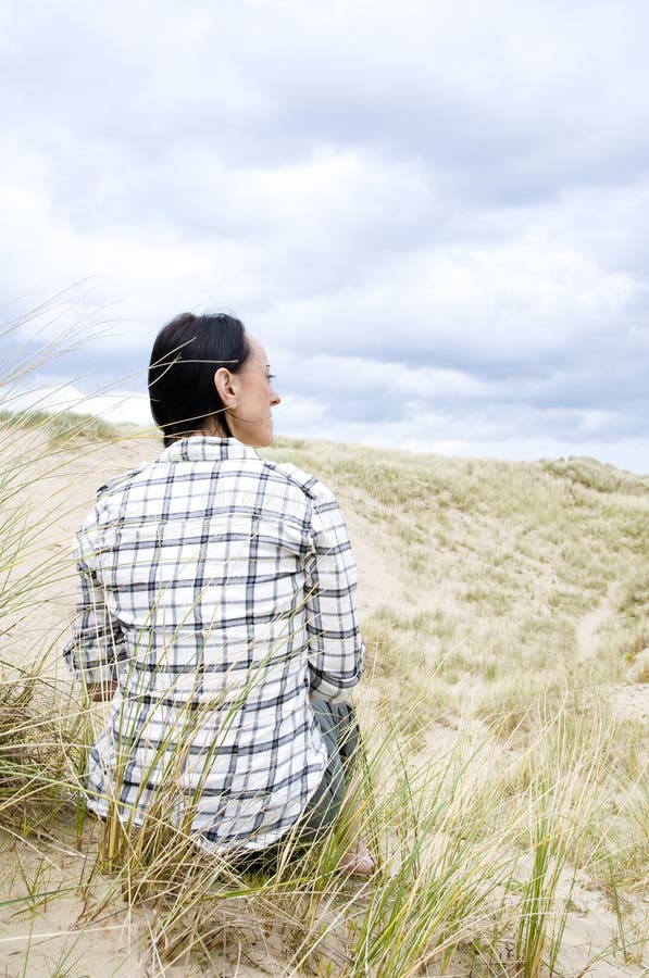 Woman Sitting in Sand Dunes Stock Photo - Image of girl, holiday: 24754294
