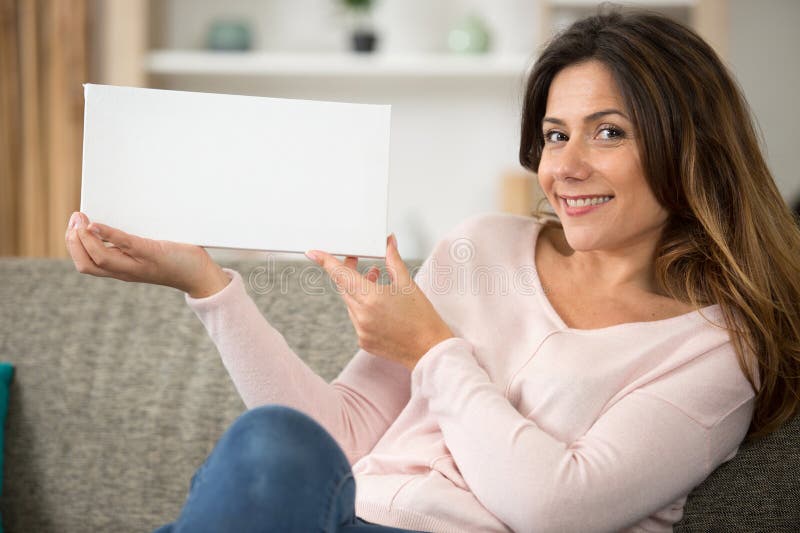 Woman Sitting on Sofa Shows Panel Stock Photo - Image of presenting ...