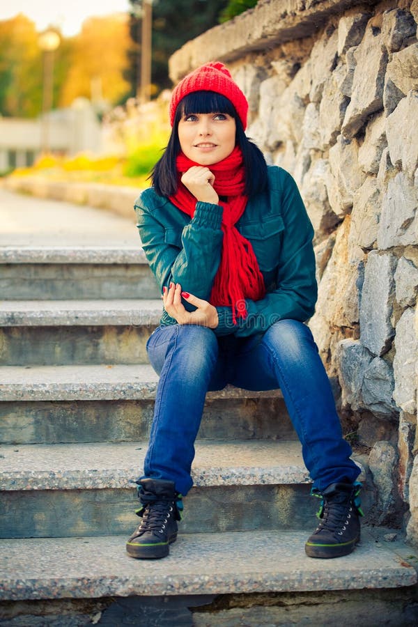 Woman sitting on stairs stock image. Image of portrait - 180672243
