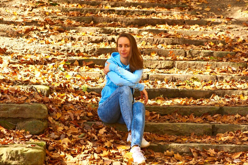 Woman sitting on steps stock photo. Image of fall, step - 56494336