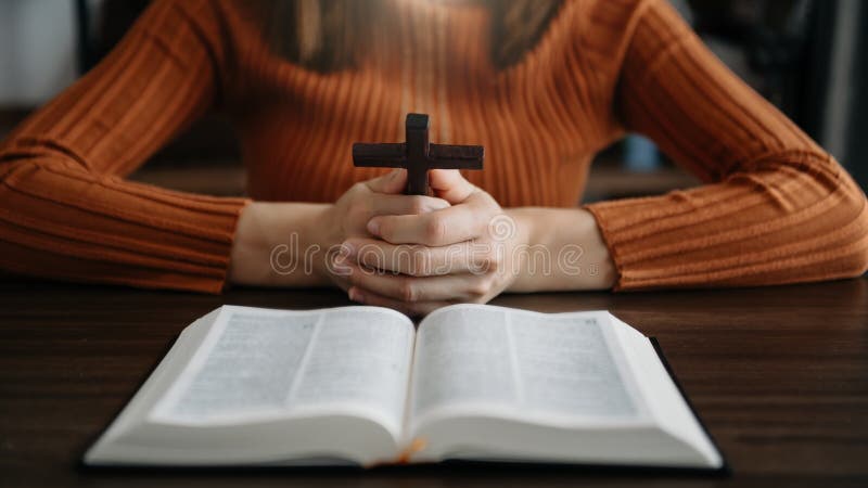 Woman Sitting and Studying the Scriptures.the Wooden Cross in the Hands ...