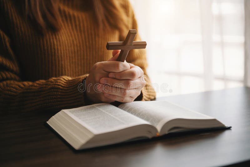 Woman Sitting and Studying the Scriptures.the Wooden Cross in the Hands ...
