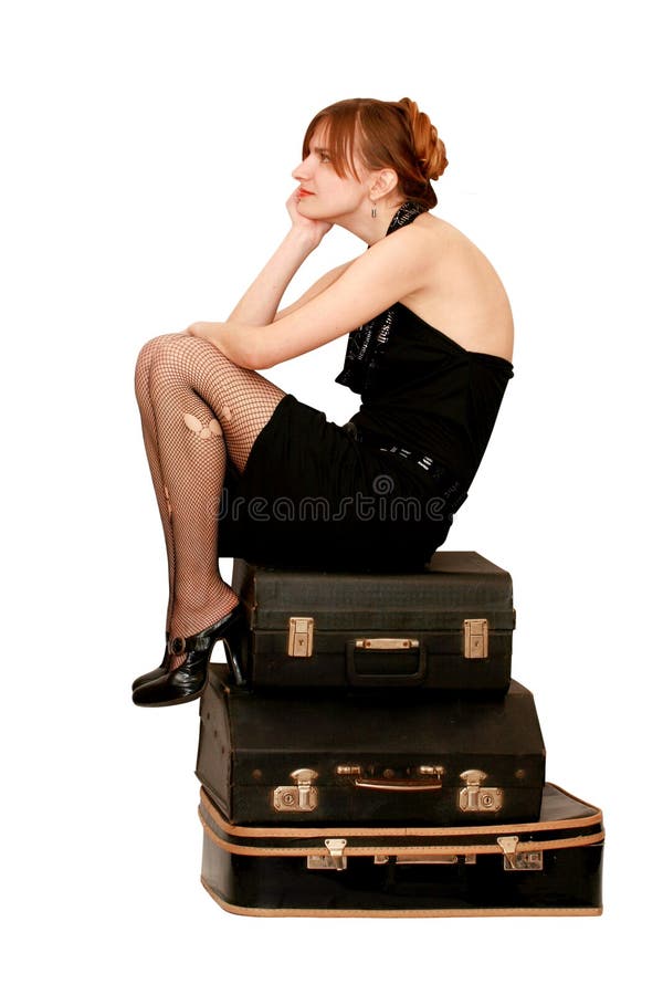 Woman sitting on suitcases stock photo. Image of annoyance - 10403034
