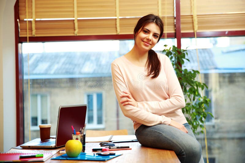 Woman Sitting on the Table at Her Workplace Stock Image - Image of cute ...