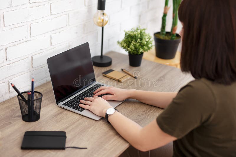 Woman Sitting at the Table and Typing on the Computer Stock Image ...