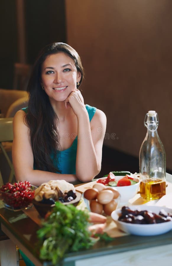 Woman Sitting at the Table Vegetables and Eggs Stock Image - Image of ...