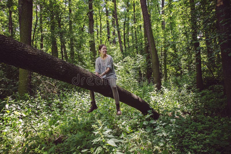 Woman Sitting on the Tree and Enjoying Nature Around Her Stock Image ...