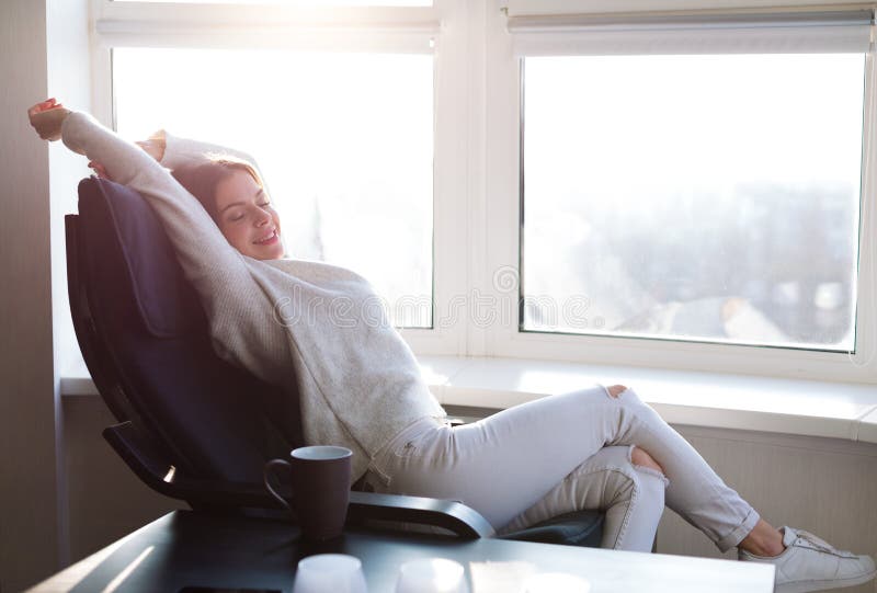 Woman Sitting by the Window Stock Photo - Image of fashion, stretching ...